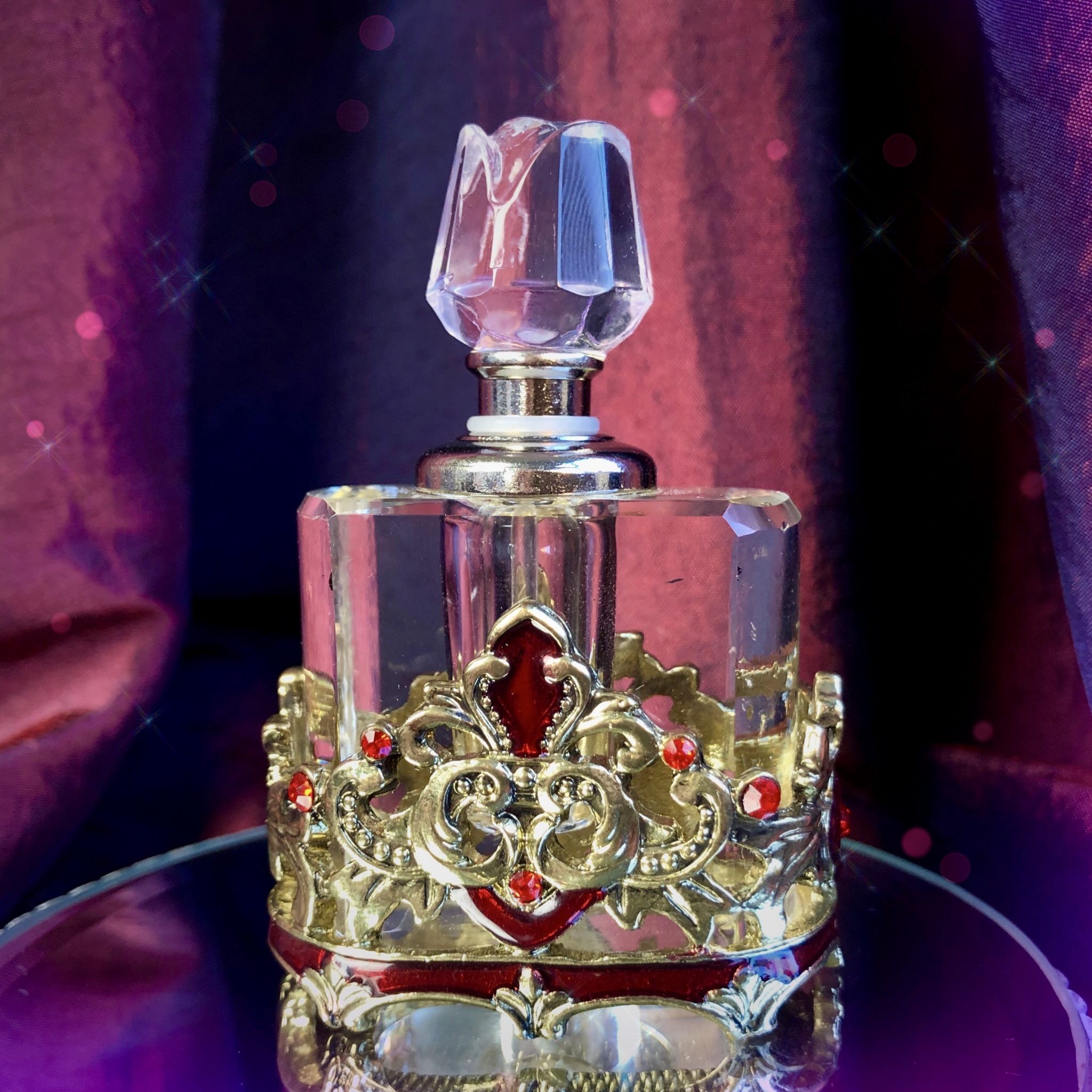 Red jeweled mini perfume bottles with Threefold Perfume for mindfulness